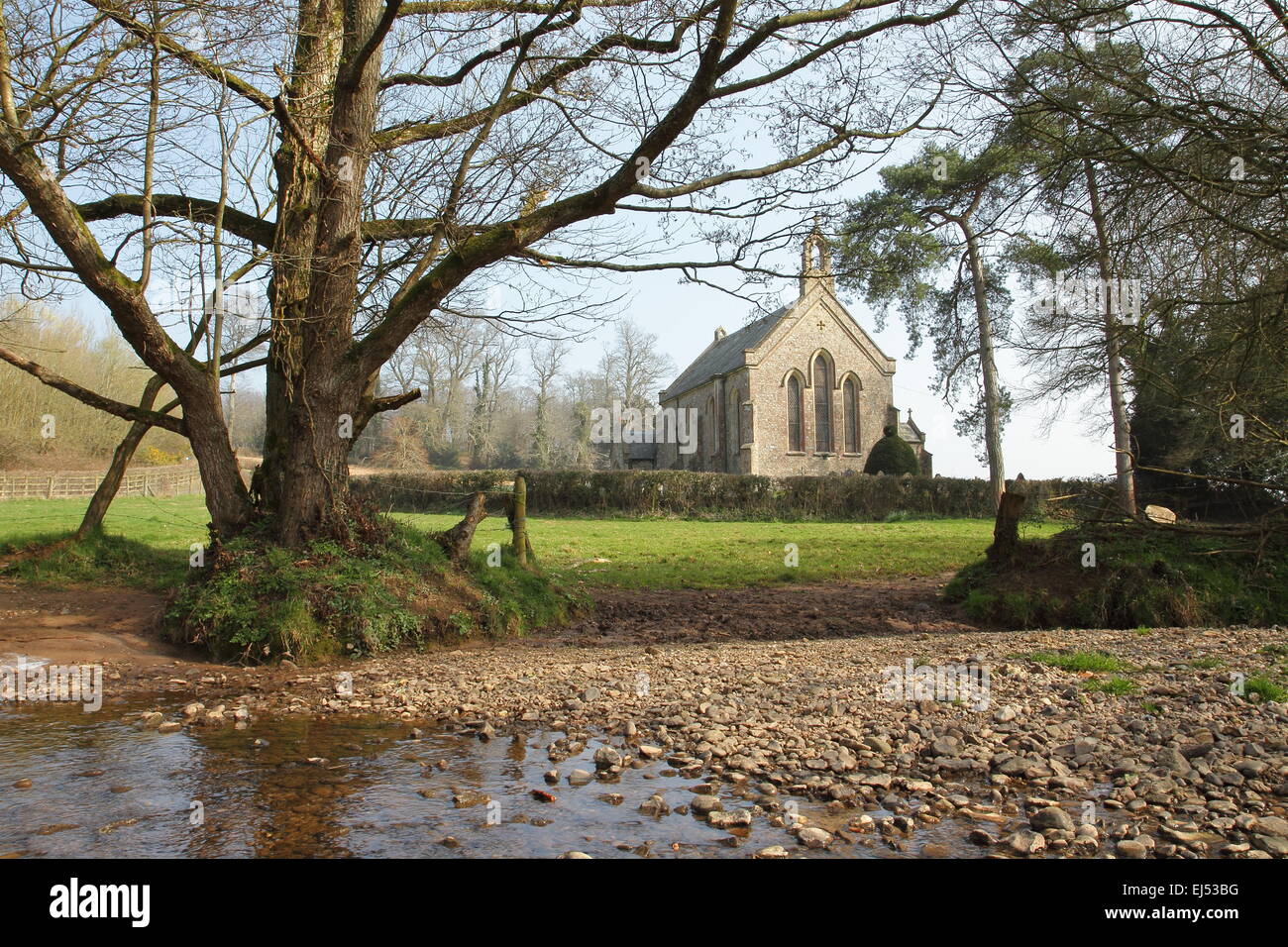 English church beside a river Stock Photo - Alamy