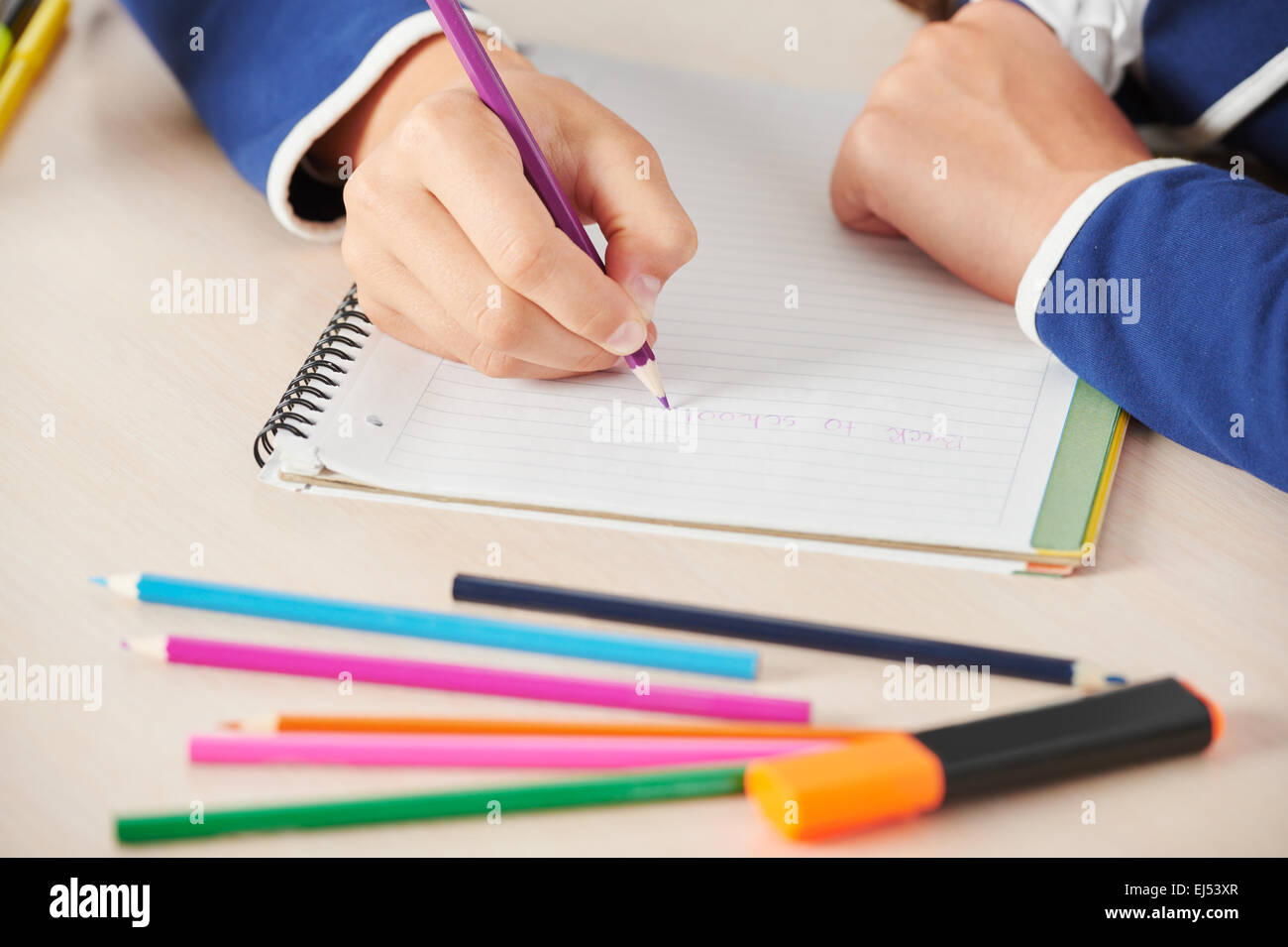 Schoolgirl writing hi-res stock photography and images - Alamy
