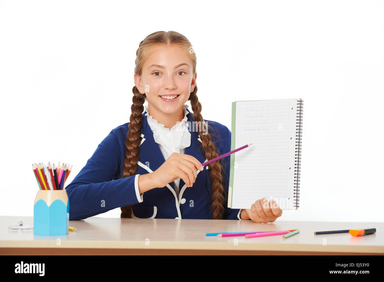 Happy school girl with notebook Stock Photo - Alamy