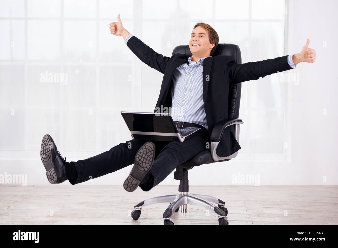 Business man reposing on headchair Stock Photo - Alamy