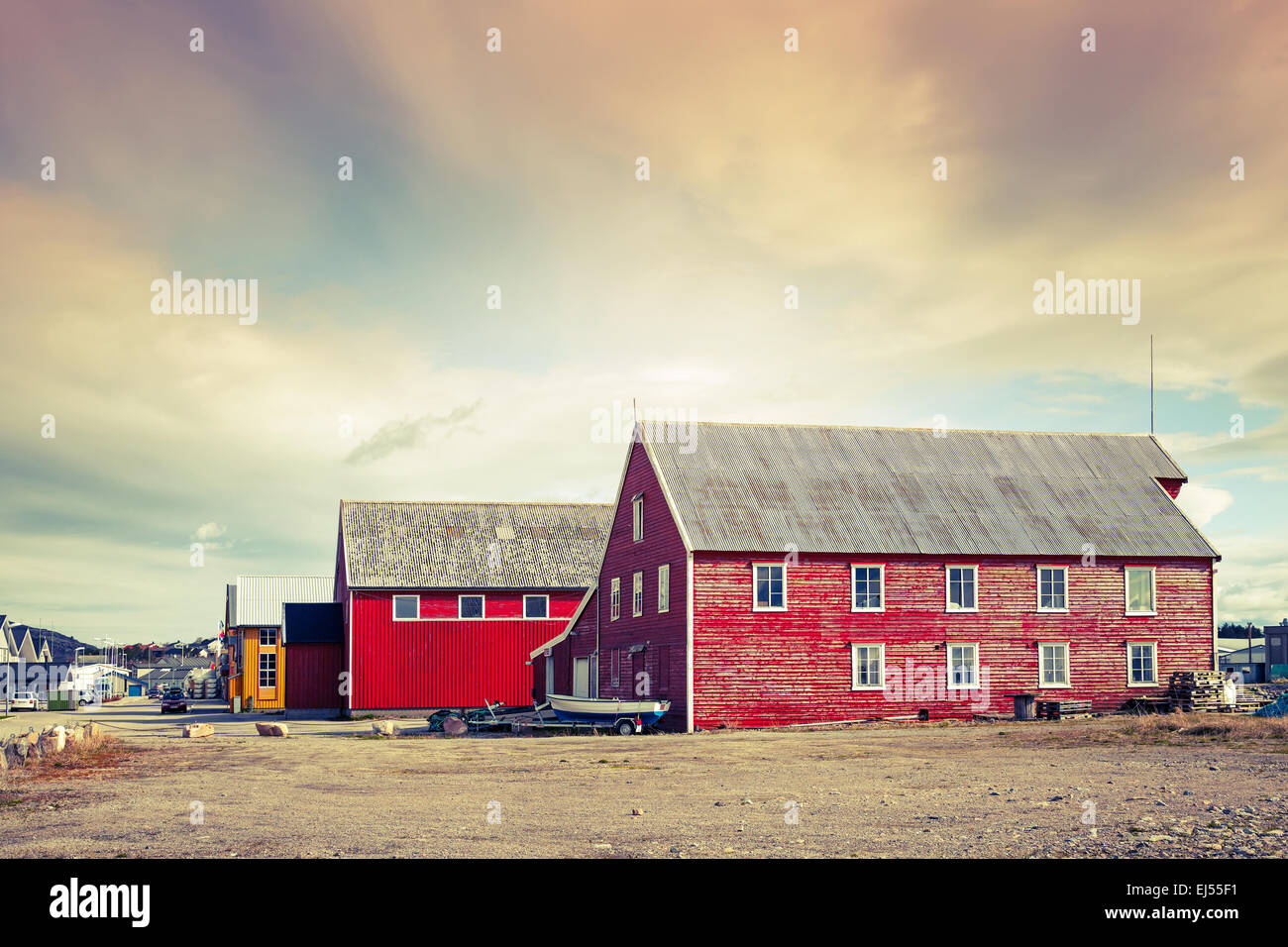 Red wooden fishing barns on the coast in Rorvik town, Norway. Vintage ...