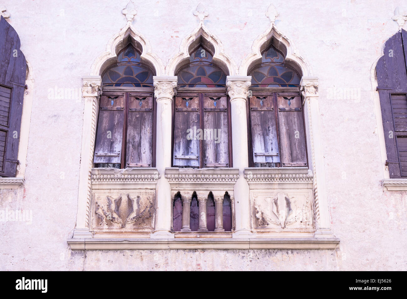 old windows on a medieval palace facade in Verona, Italy Stock Photo ...