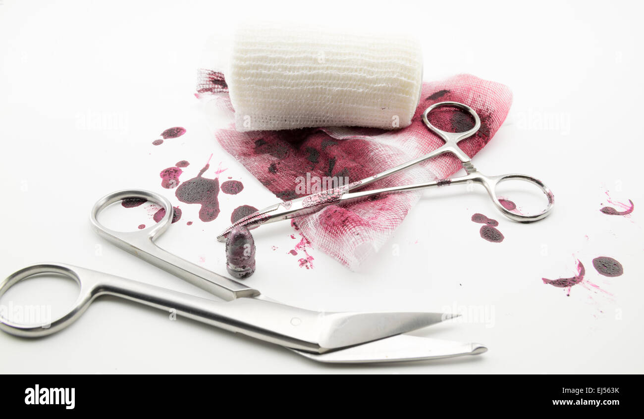 Surgical composition with bullet, blood and bandage Stock Photo - Alamy
