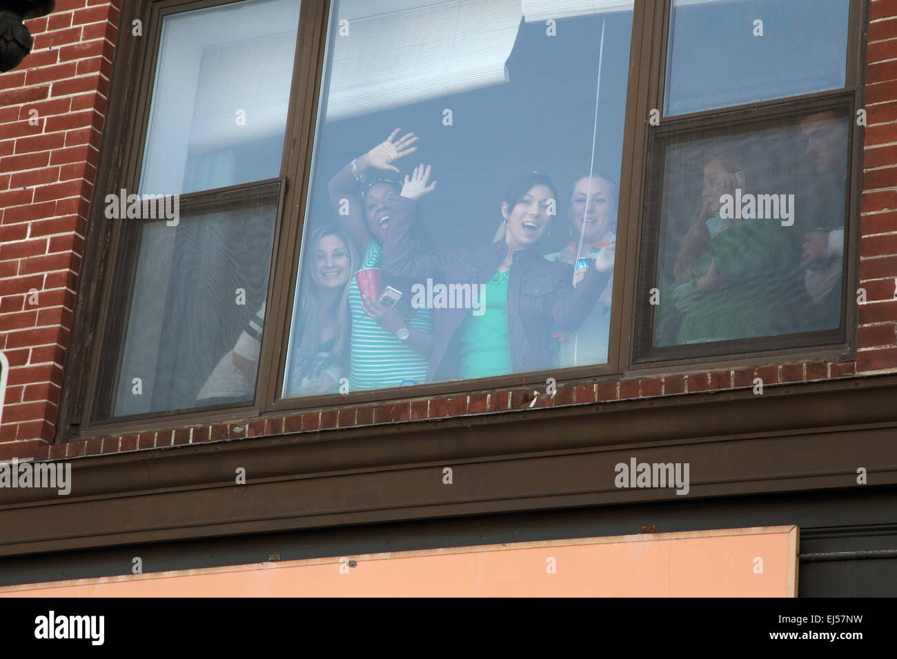 Enthusiastic college girls in window, St. Patrick's Day Parade, 2014 ...
