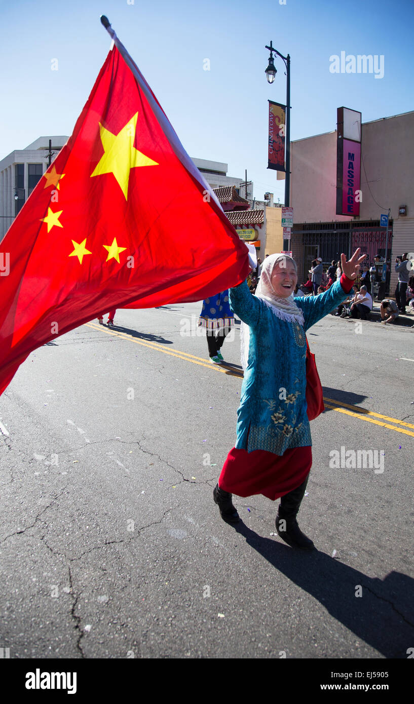 Woman displays Chinese flag at Chinese New Year parade, 2014, Year of ...