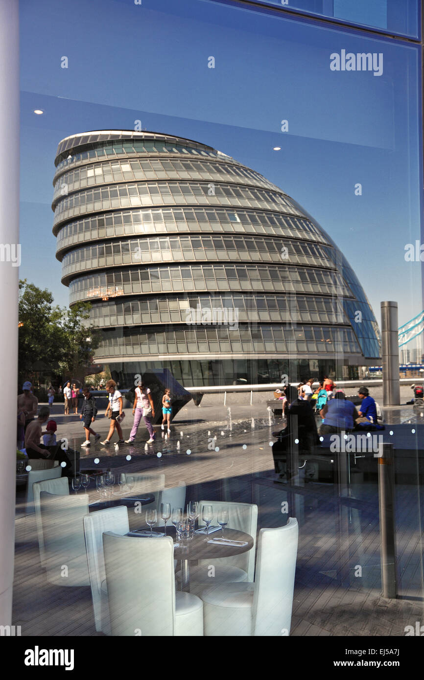 Reflections of the London assembly building in the Gaucho restaurant ...