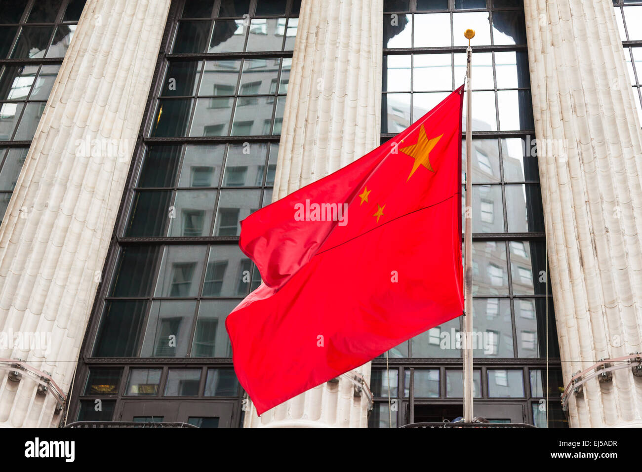 Chinese flag floating in front of a goverment building Stock Photo - Alamy
