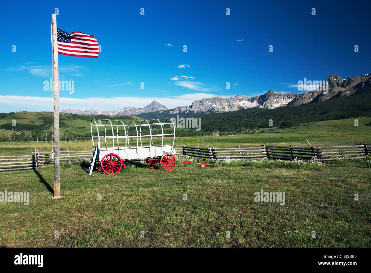US Flag and covered wagon, Hastings Mesa, near Ridgway, Colorado, USA ...