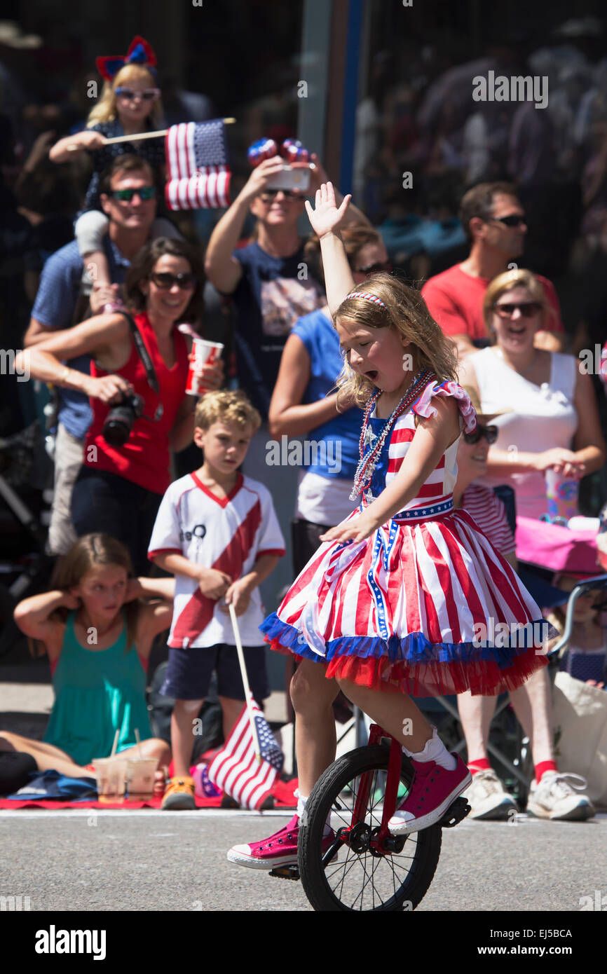 Girl rides unicycle during July 4, Independence Day Parade, Telluride ...