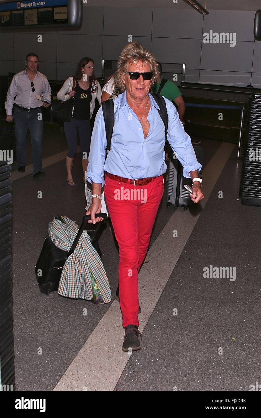 Rod Stewart wearing red trousers arrives Los Angeles International ...