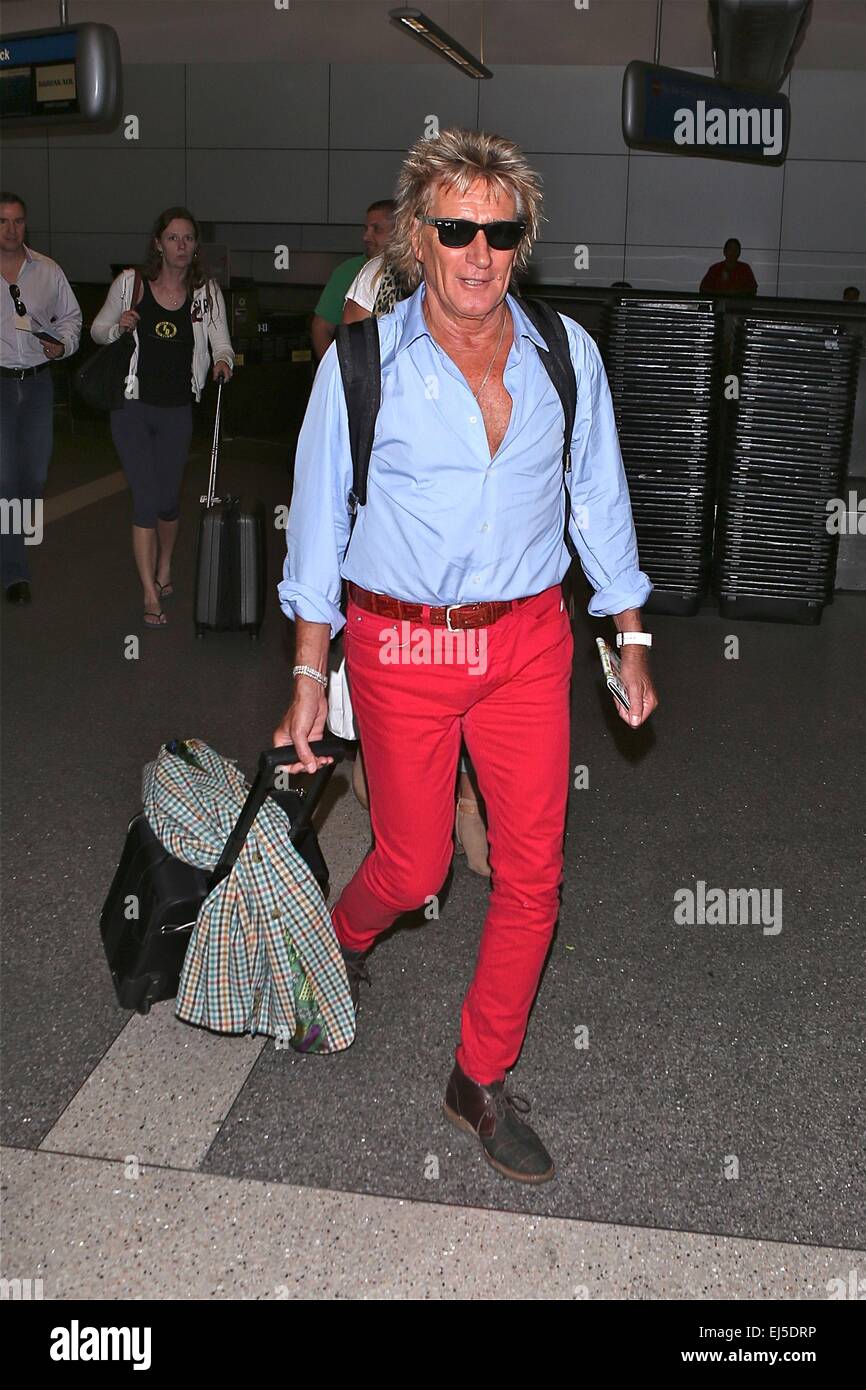 Rod Stewart wearing red trousers arrives Los Angeles International ...
