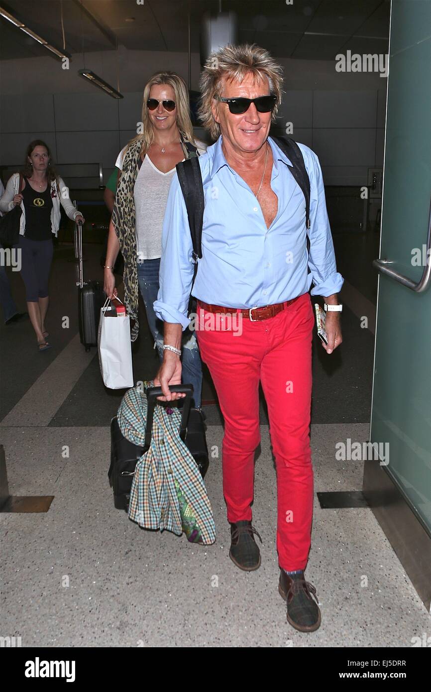Rod Stewart wearing red trousers arrives Los Angeles International ...
