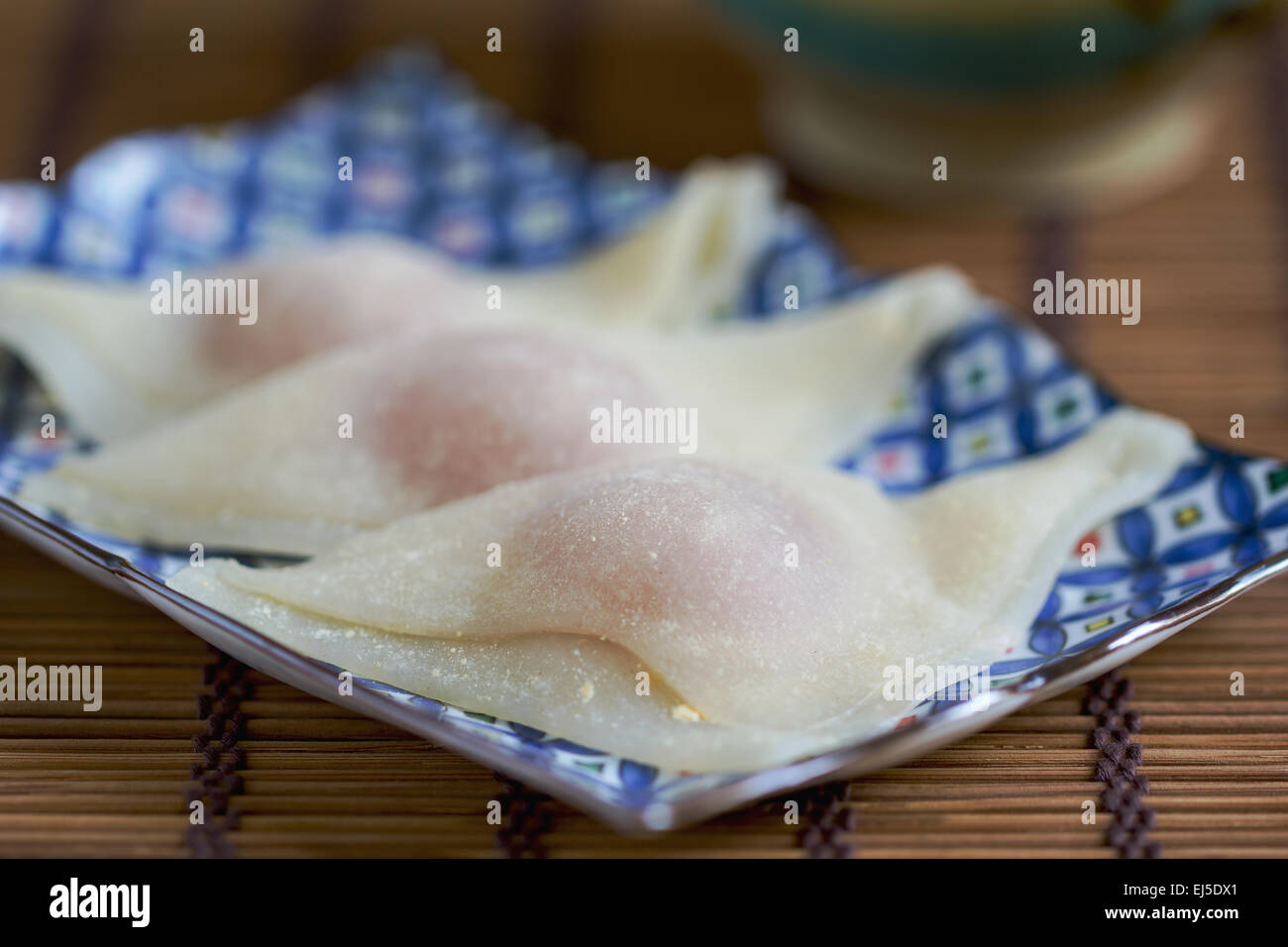 Traditional Kyoto Sakura Mochi in triangle shape Stock Photo - Alamy
