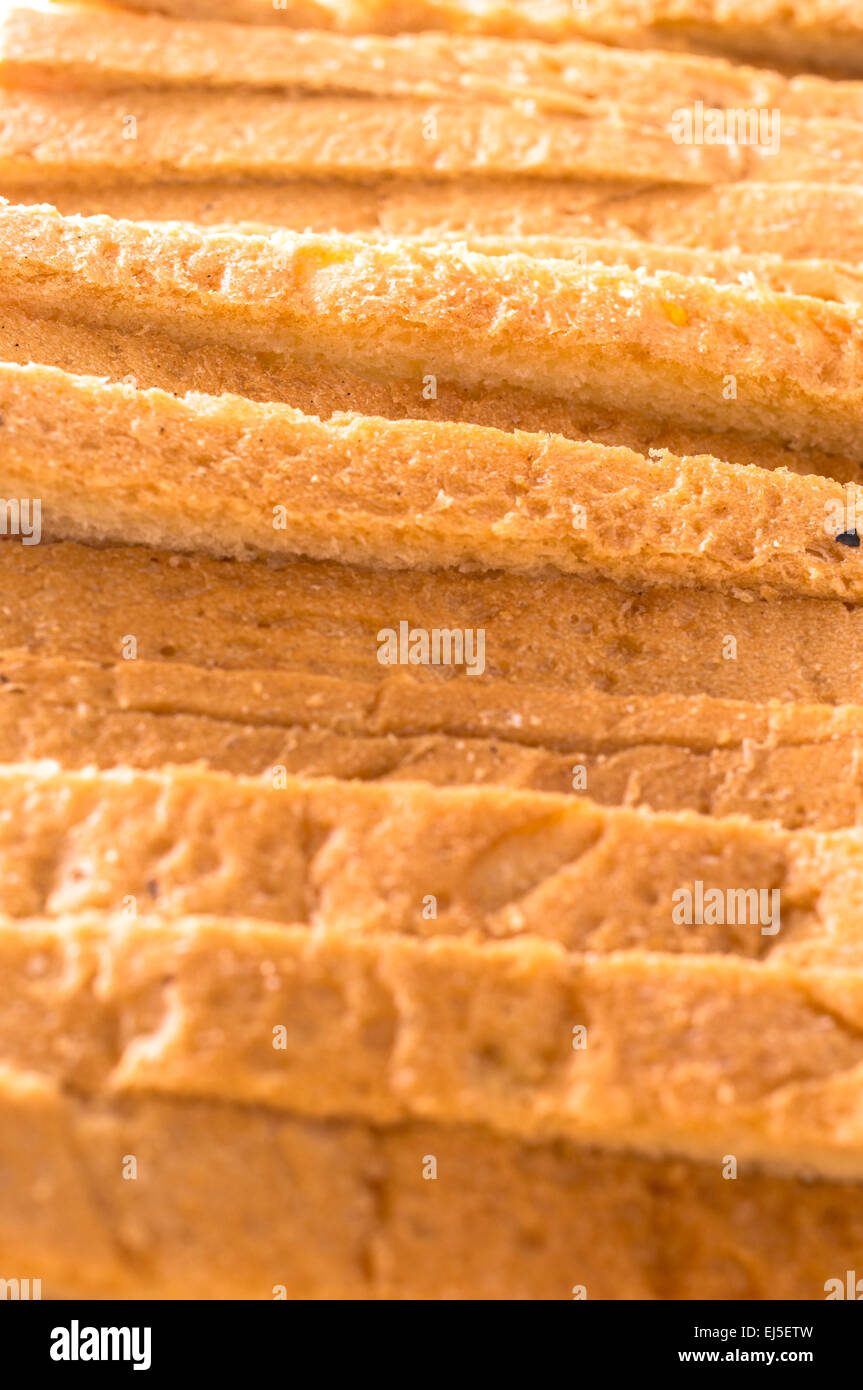 Toast bread slices to a lot of background Stock Photo - Alamy