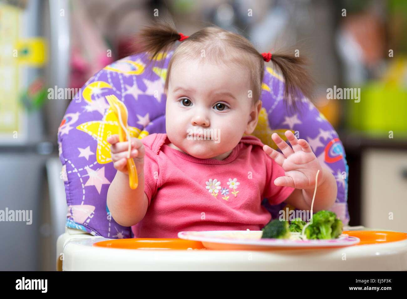 kid eating food on kitchen Stock Photo - Alamy
