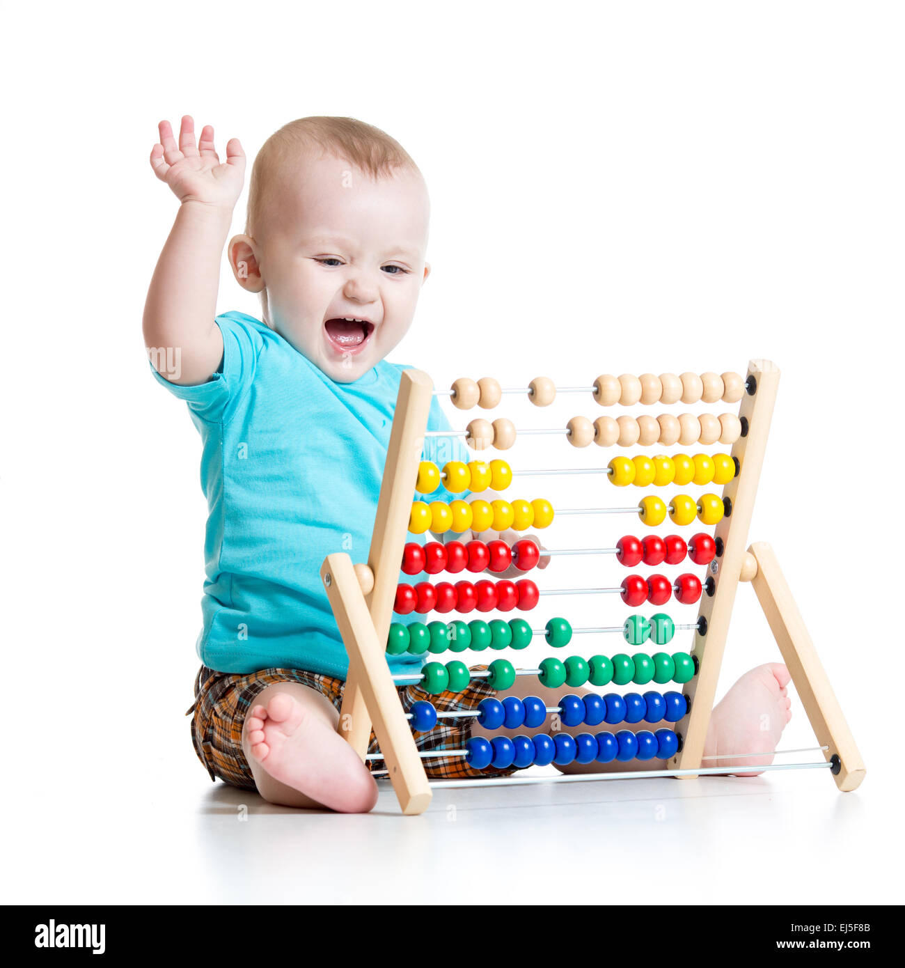 Happy baby playing with counter toy Stock Photo - Alamy