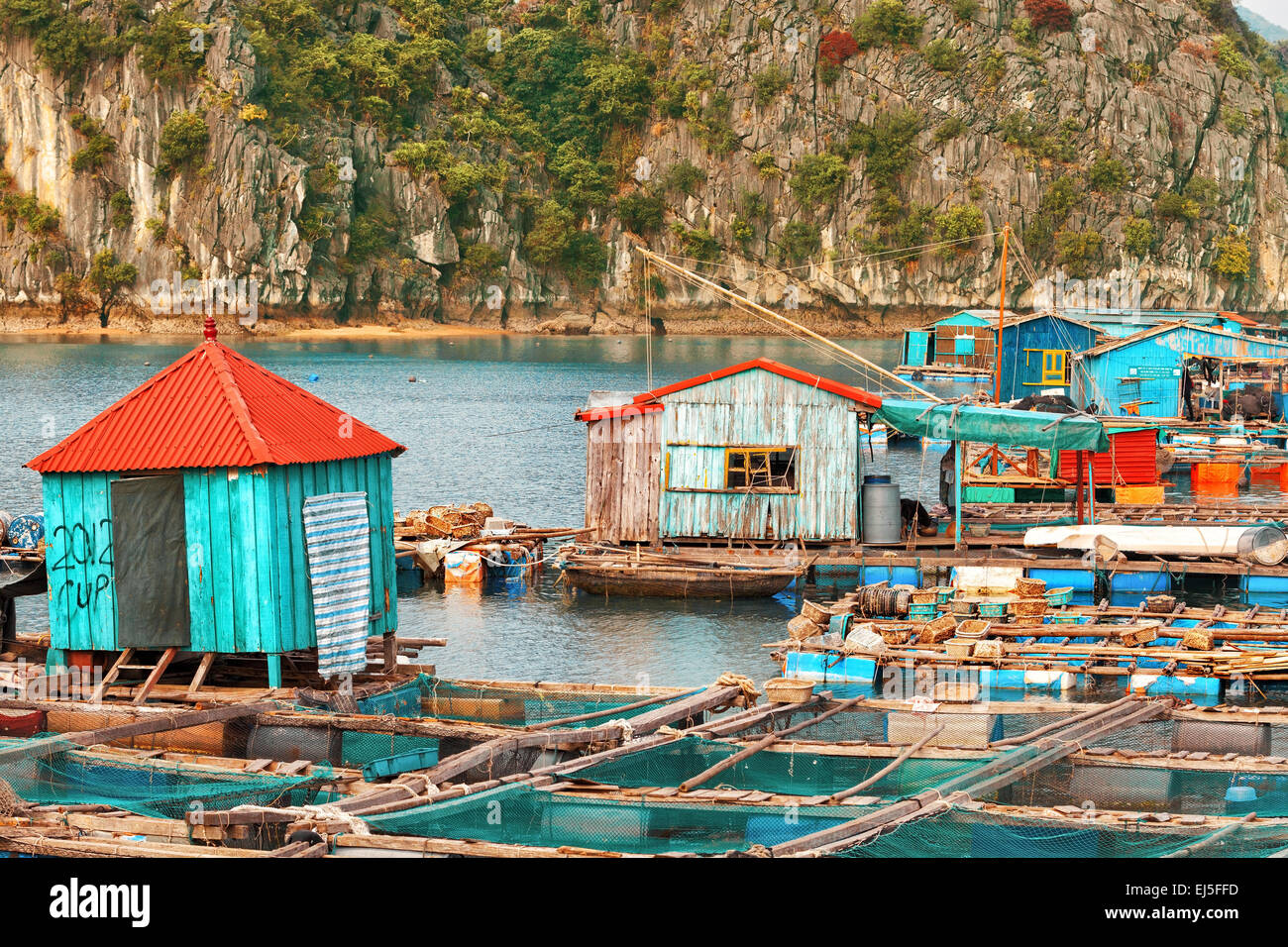 Asian floating village at Halong Bay Stock Photo - Alamy