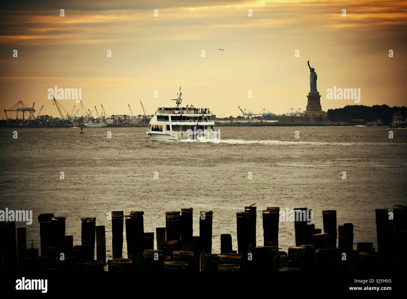 Statue of Liberty at New York City harbor with pier Stock Photo - Alamy