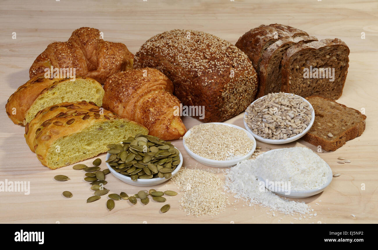 Variety of bread and ingredients on wooden background Stock Photo - Alamy