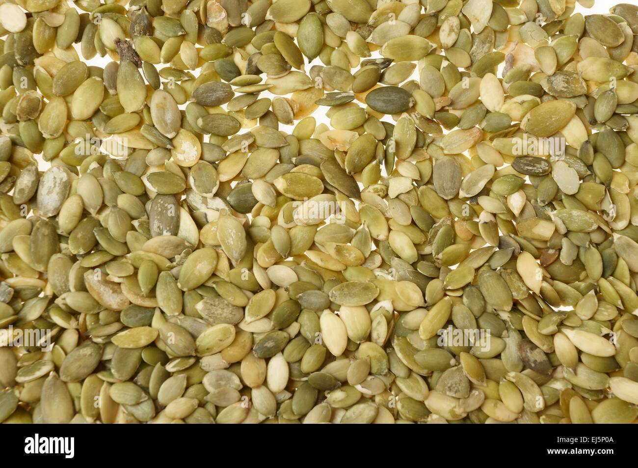 Peeled pumpkin seeds as a food background Stock Photo - Alamy