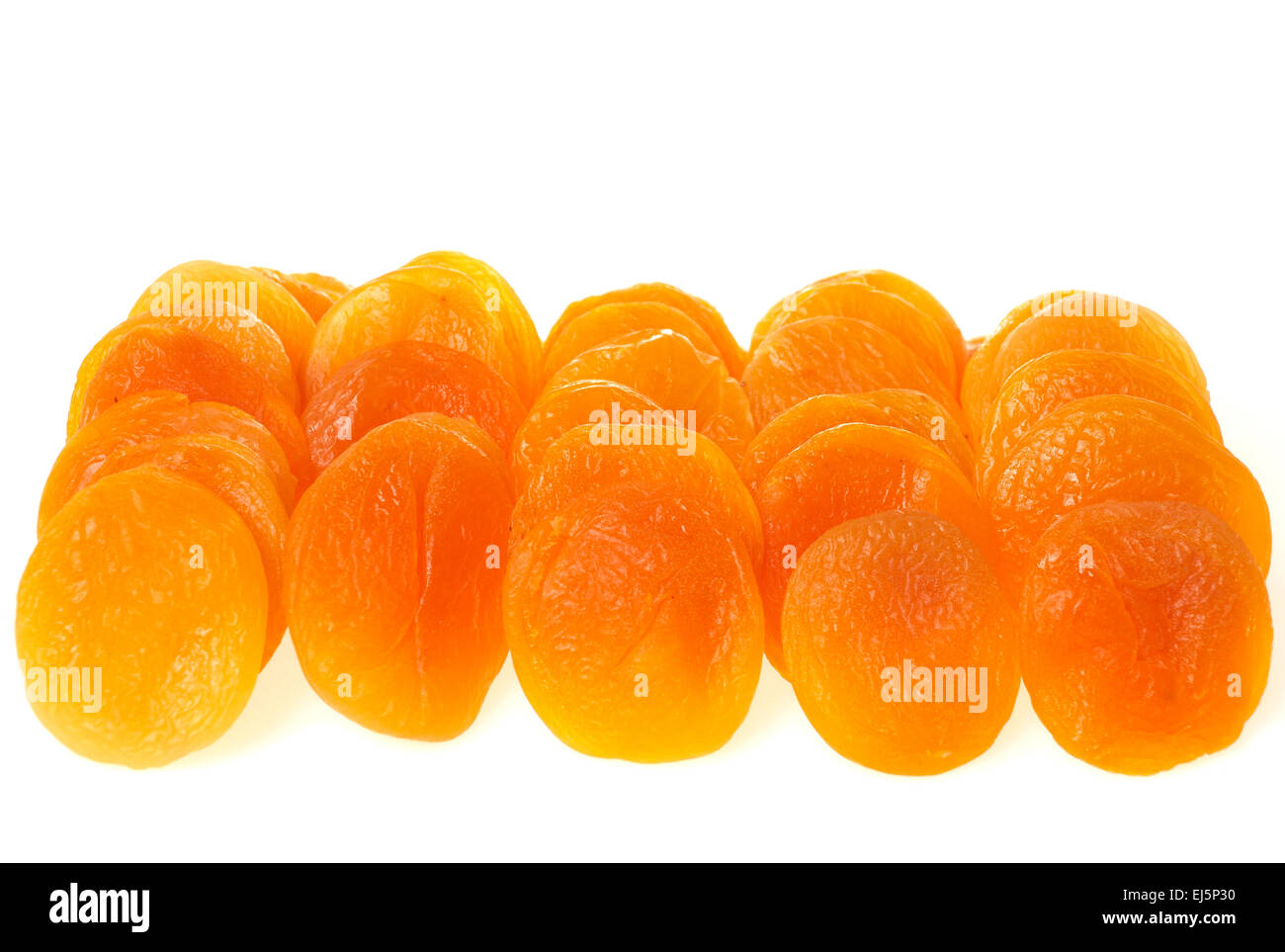 Dried apricots fruit isolated Cut Out Stock Images & Pictures - Alamy