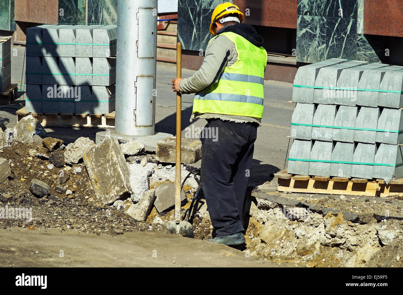 Man is working at the road construction Stock Photo - Alamy