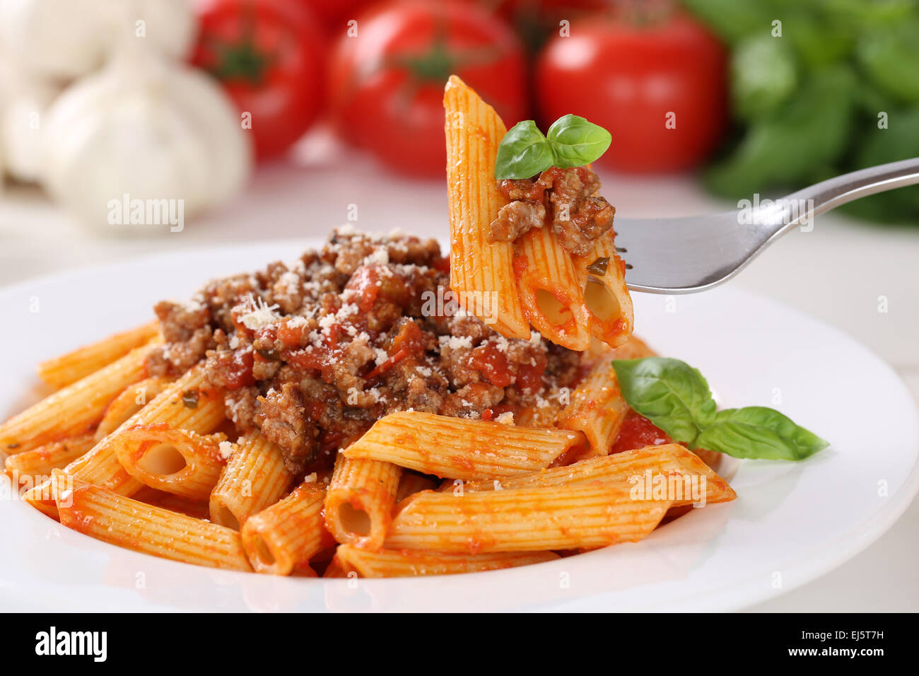 Eating pasta Bolognese or Bolognaise sauce noodles meal on a plate ...