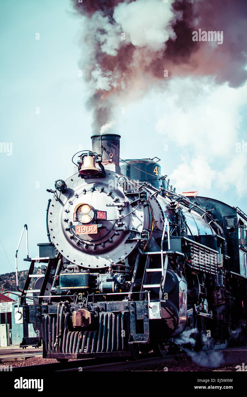 Old steam locomotive against blue cloudy sky, vintage train Stock Photo ...