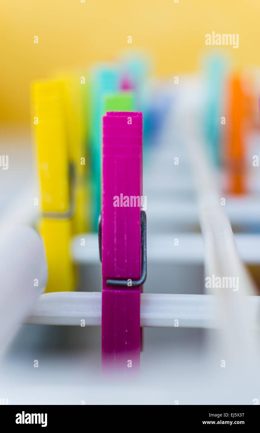 Colored pegs on a washing line Stock Photo - Alamy