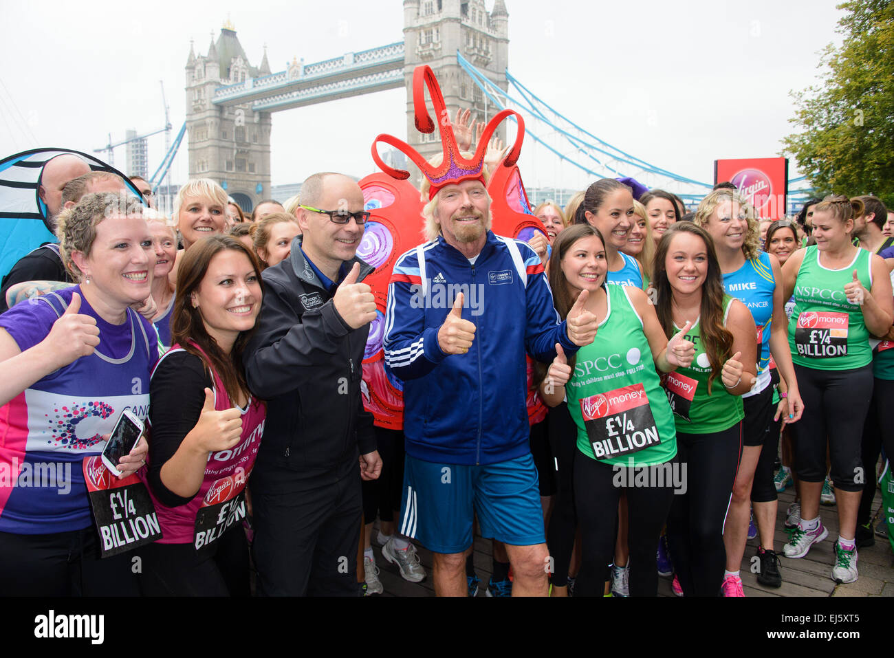Sir Richard Branson and Hugh Brasher along with charity runners who ...