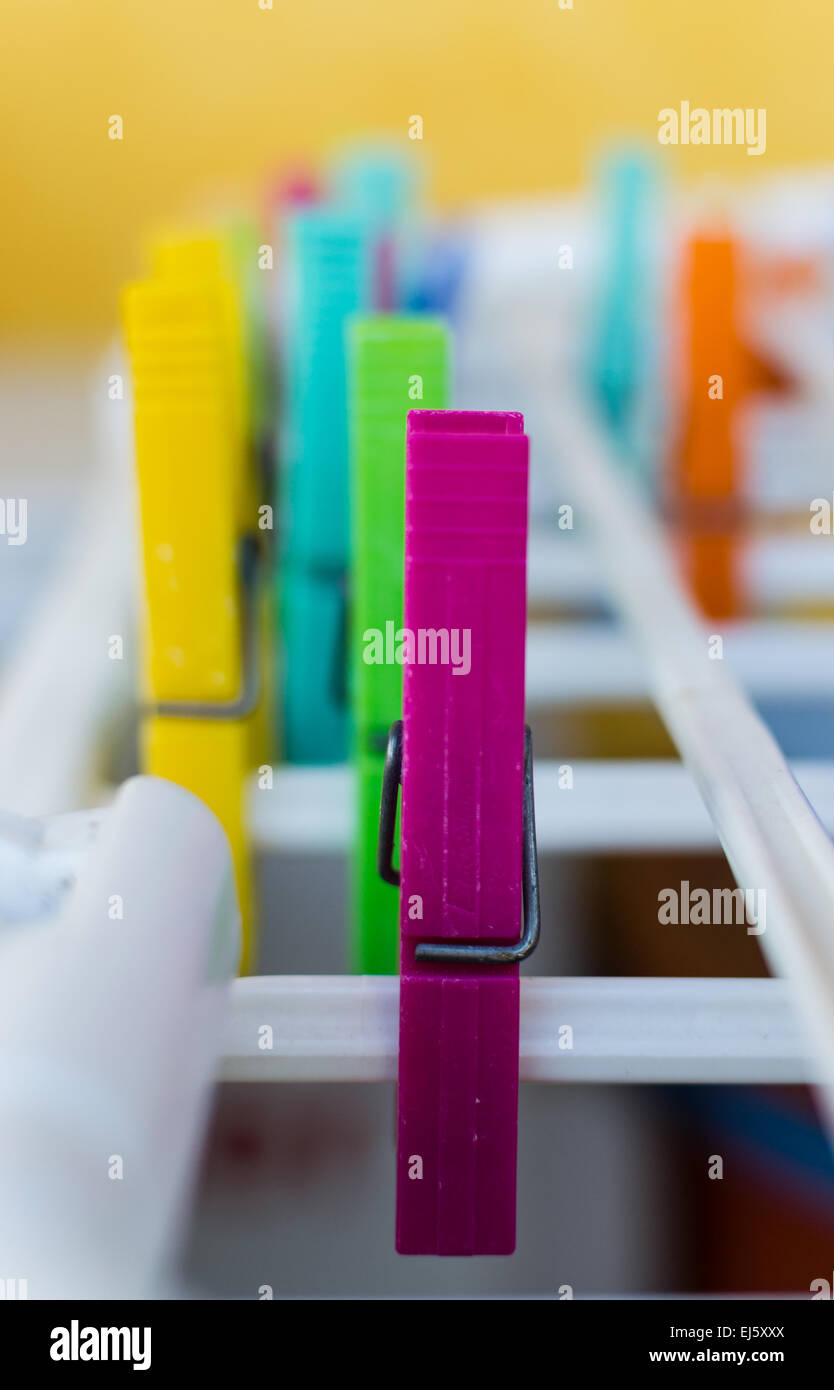 Colored pegs on a washing line Stock Photo - Alamy