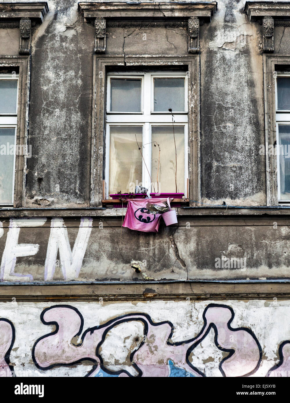 Dilapidated exterior, window and graffiti on old squatters' building in ...