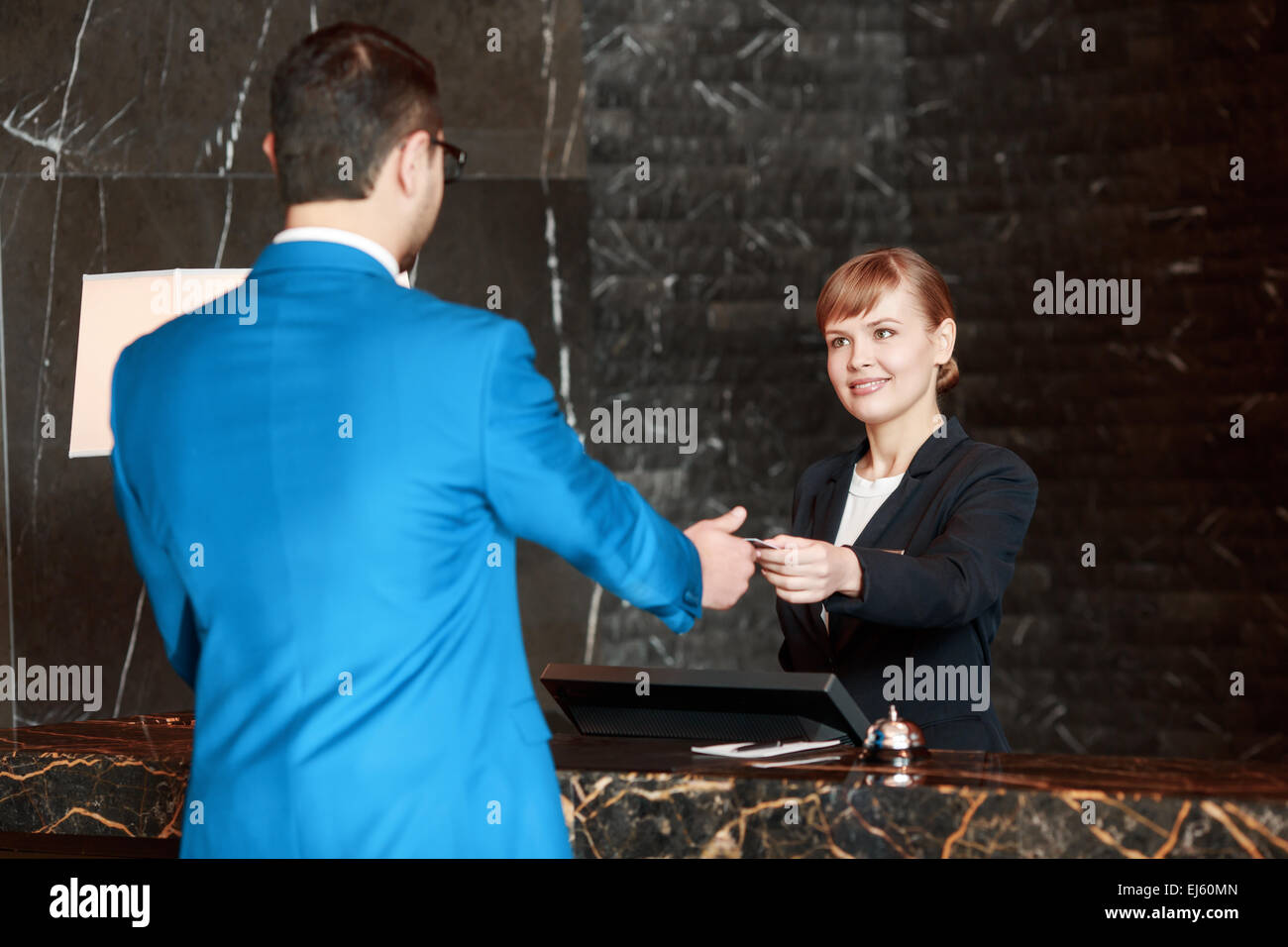 Receptionist work behind counter hi-res stock photography and images ...