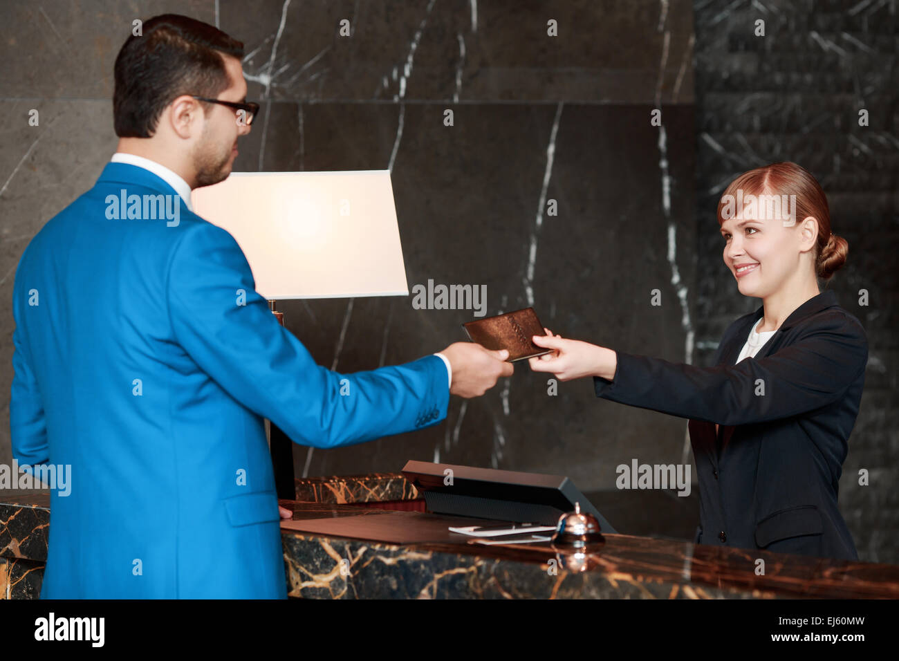 Hotel receptionist hi-res stock photography and images - Alamy