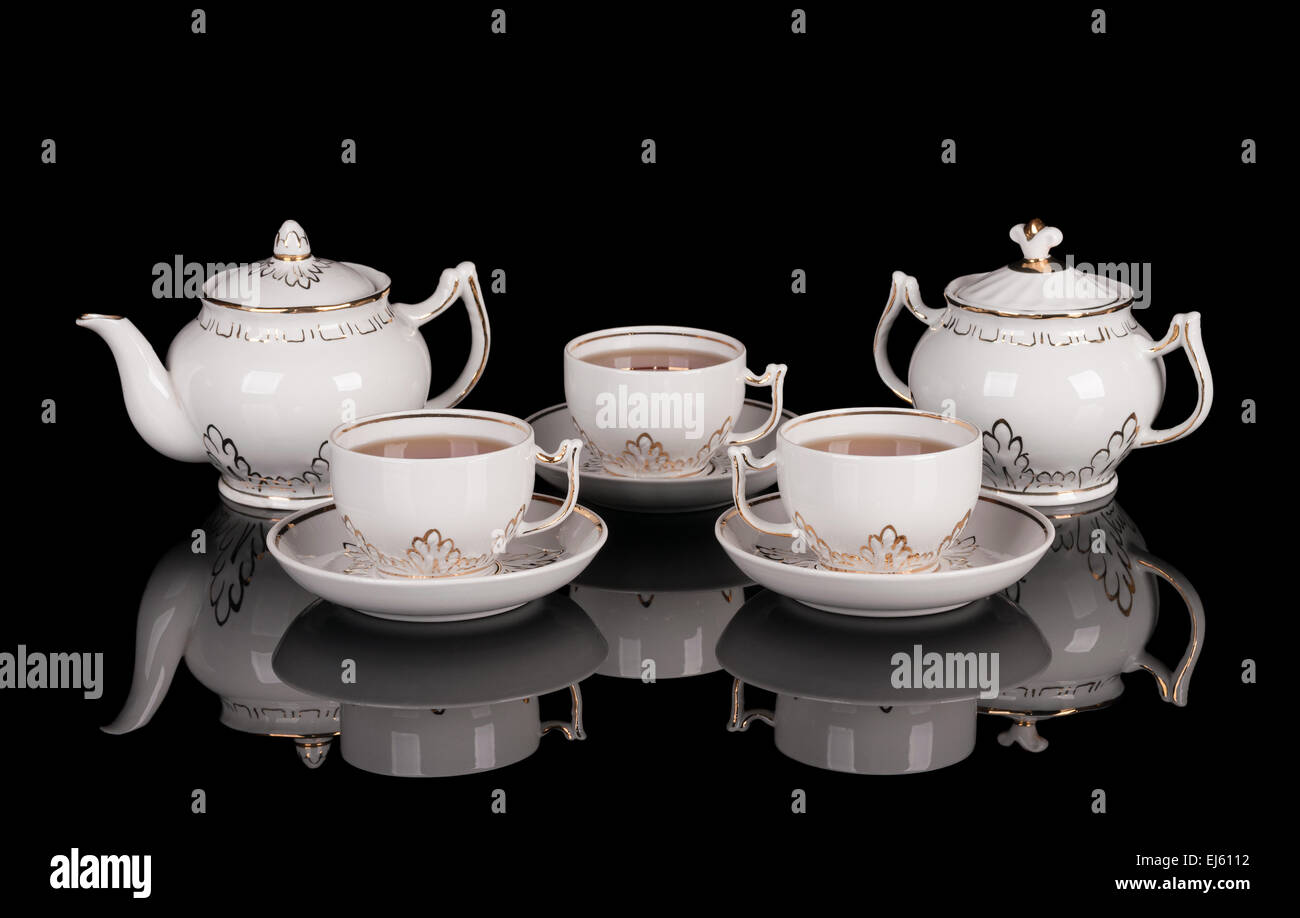 White porcelain tea set on black reflecting background Stock Photo - Alamy