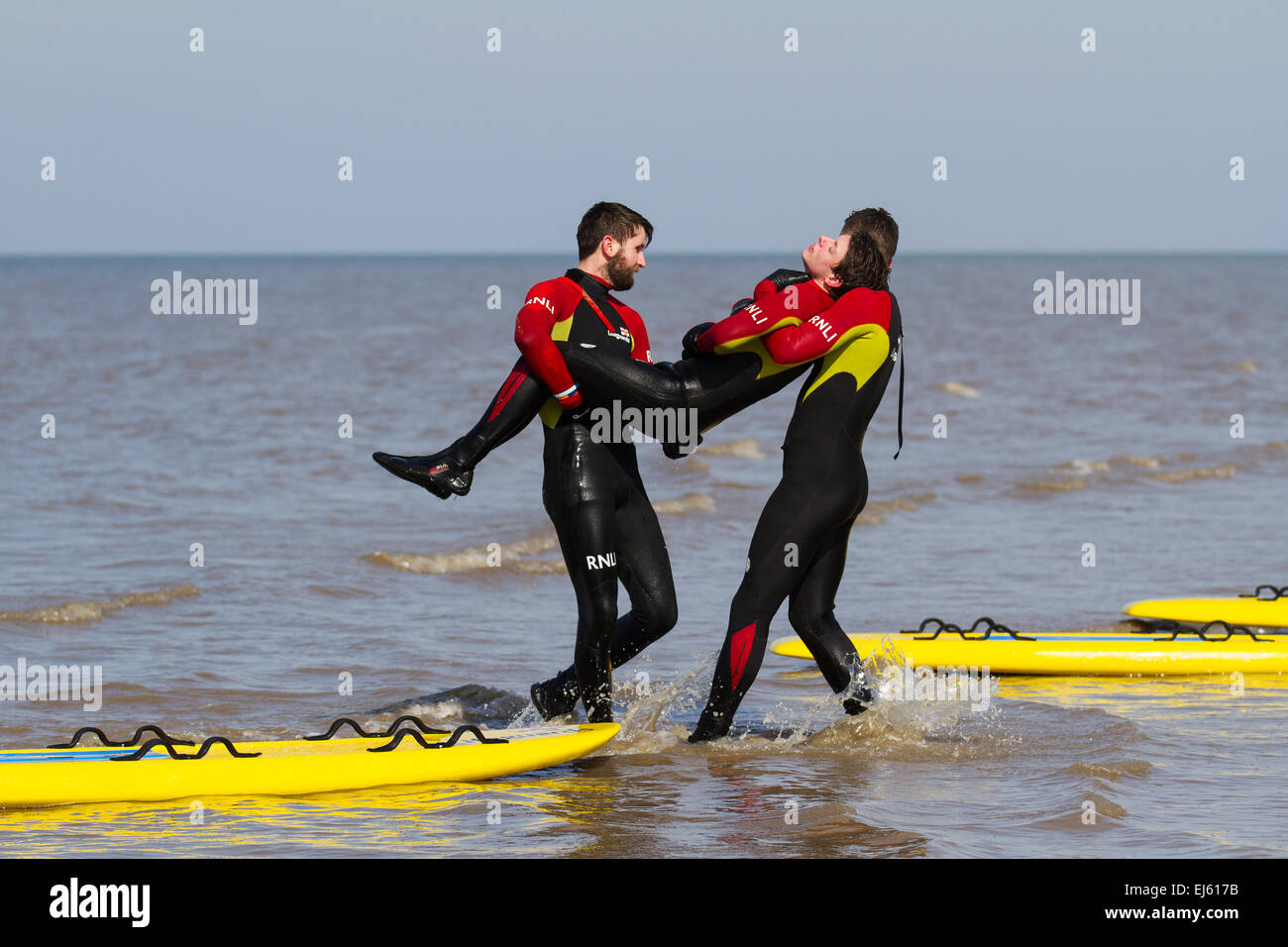 RNLI volunteer Lifeguards practice rescue land-based ﬁrst aid training ...
