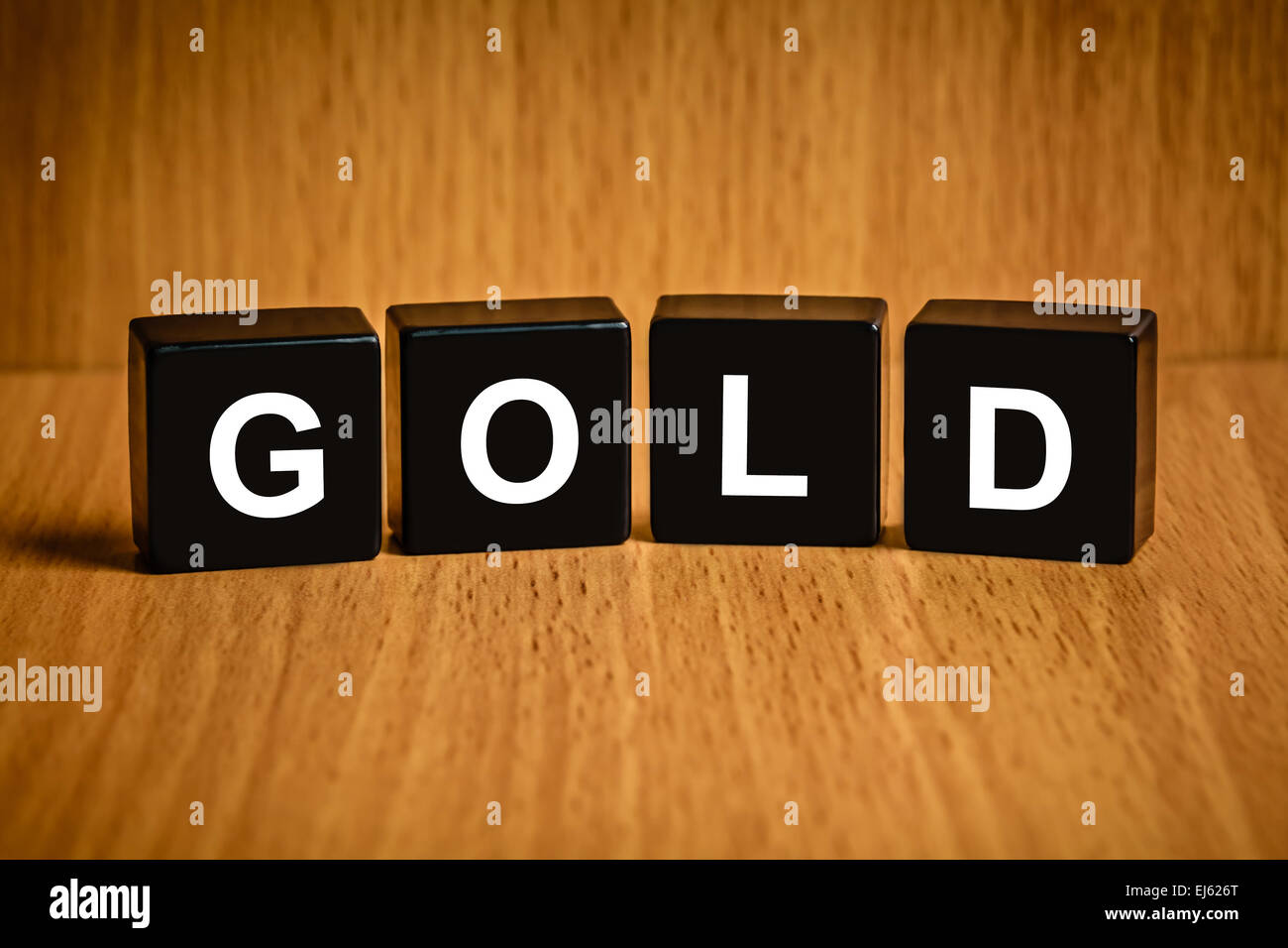 gold text on black block Stock Photo - Alamy