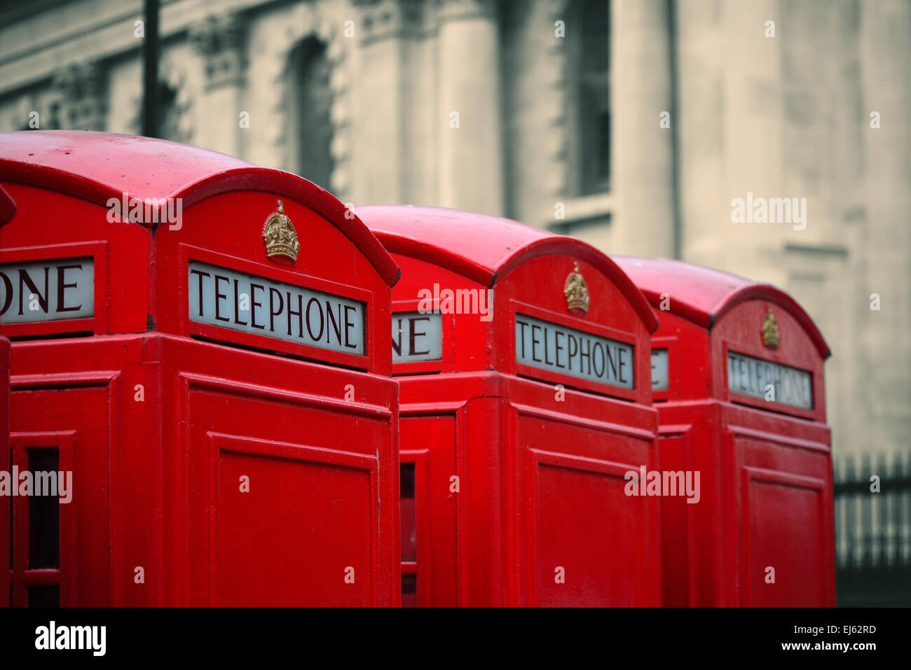 Red telephone box in street with historical architecture in London ...