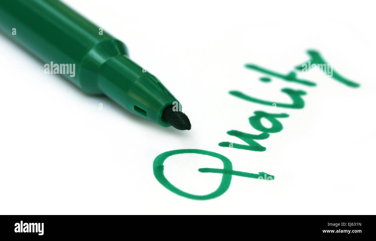 Quality written on a white paper with green pen Stock Photo - Alamy