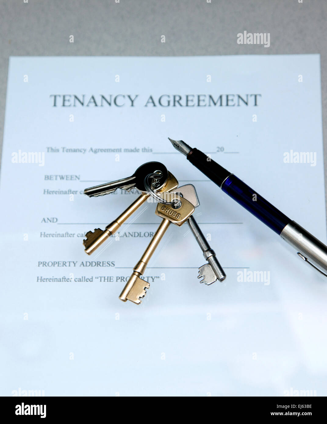 Tenancy agreement document and house keys, London Stock Photo - Alamy
