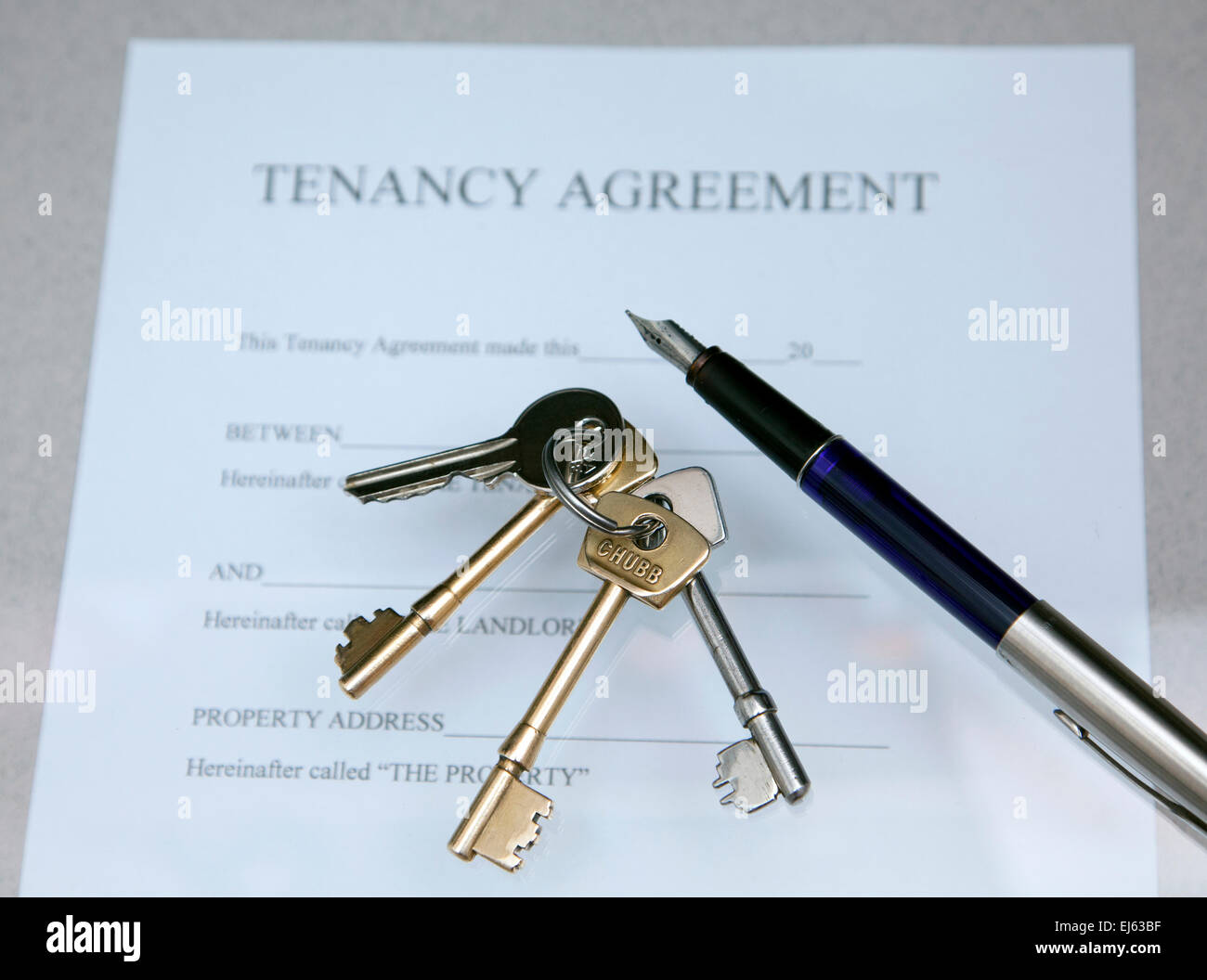 Tenancy agreement document and house keys, London Stock Photo - Alamy