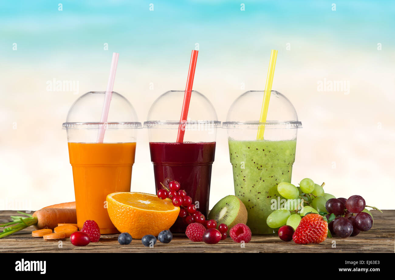Fresh juice mix fruit, healthy drinks on wooden table Stock Photo - Alamy