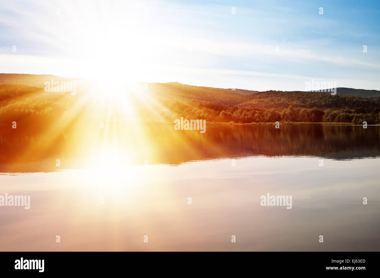 sun over lake Stock Photo - Alamy