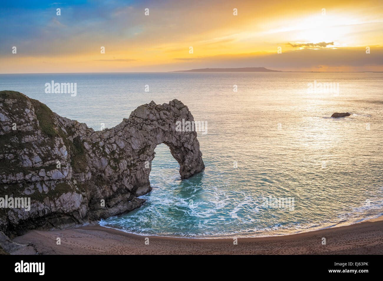 Sunset at Durdle Door natural limestone arch on the Jurassic Coast near ...