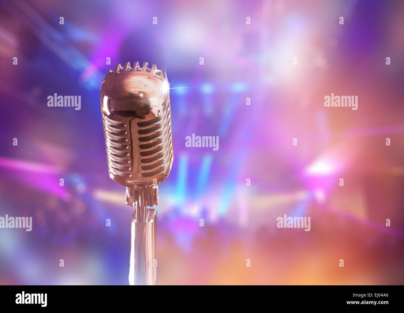 Retro microphone against colourful background Stock Photo - Alamy