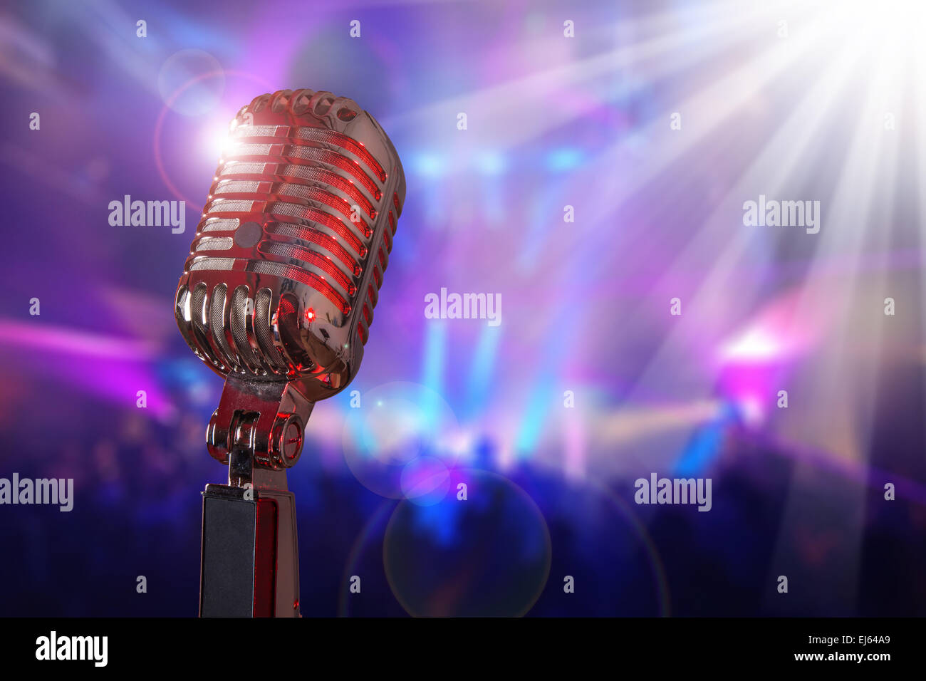 Retro microphone against colourful background Stock Photo - Alamy