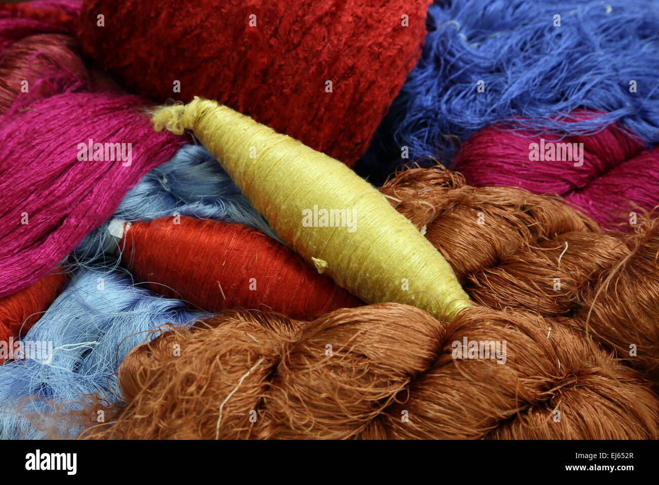 Colorful raw silk thread in the silk farm Stock Photo - Alamy