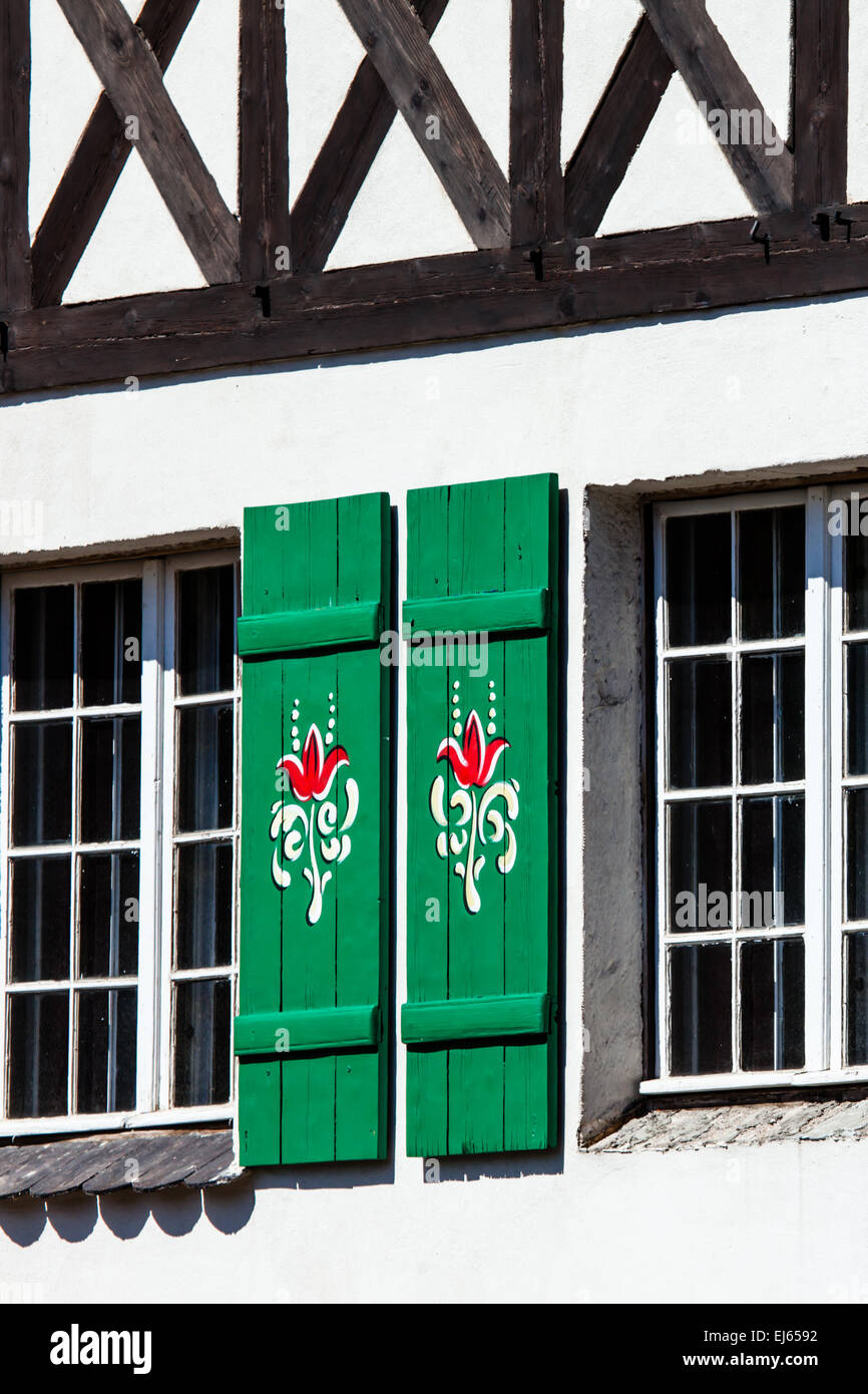 Typical germany windows with green shutters and window box Stock Photo ...