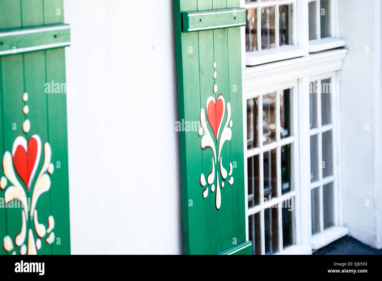 Typical germany windows with green shutters and window box Stock Photo ...