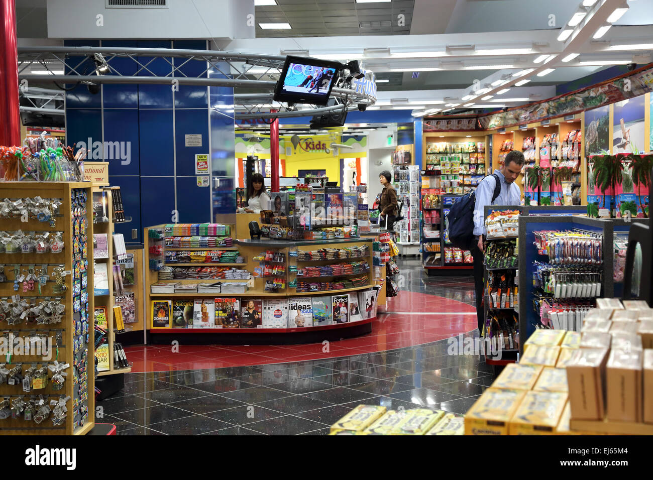 Airport travelers shop in airport store before flying Stock Photo - Alamy